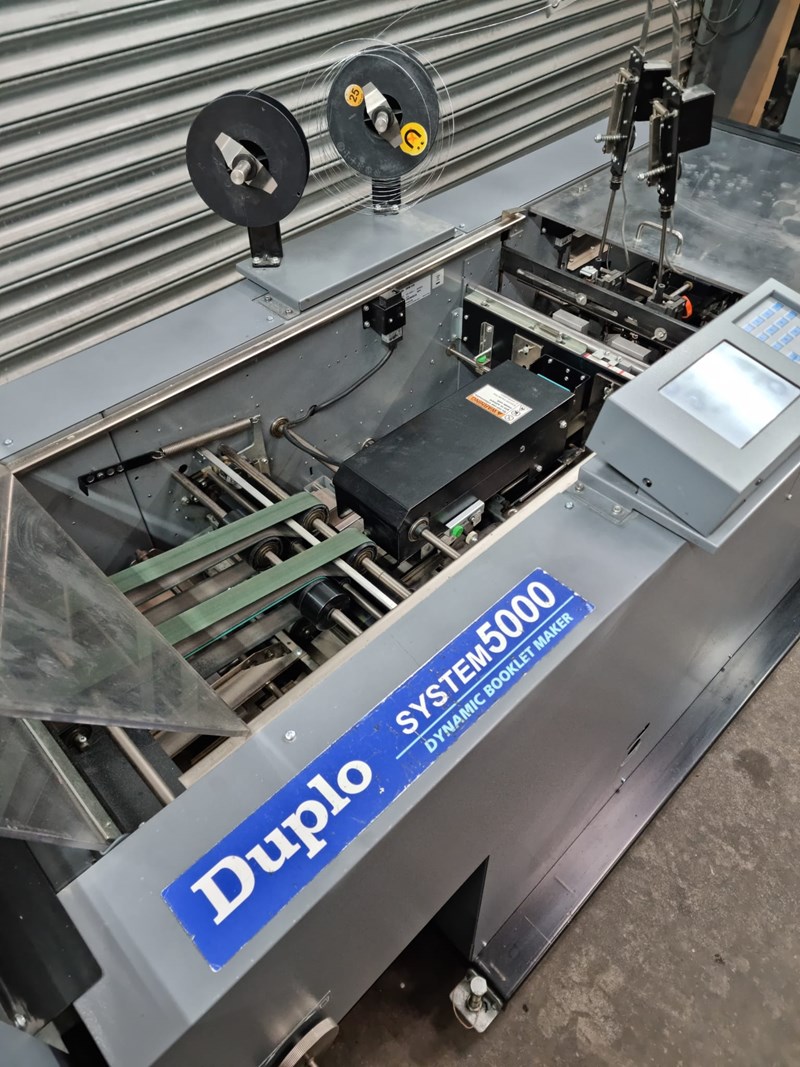 Used Duplo 5000 twin towers with fold stitch trim bookletmaker | PressCity